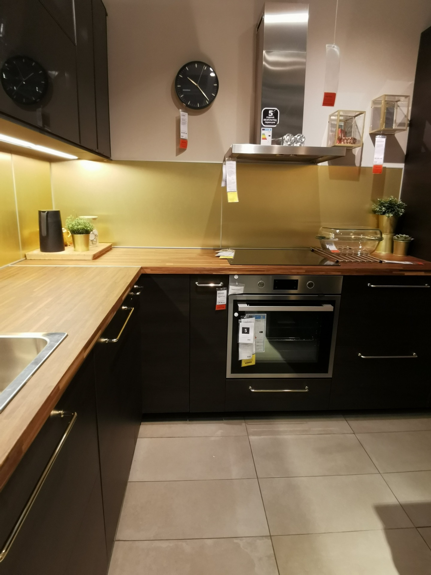 IKEA Askersund dark brown kitchen with Jutis smoked glass door